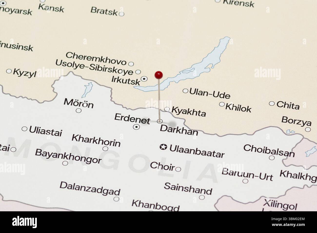 macro photo of a red pin needle into Darkhan city of Mongolia political ...
