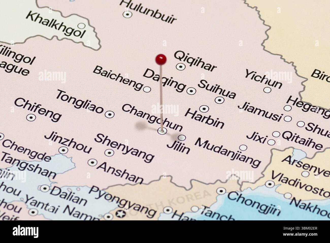 macro photo of a red pin needle into Changchun city of China political ...