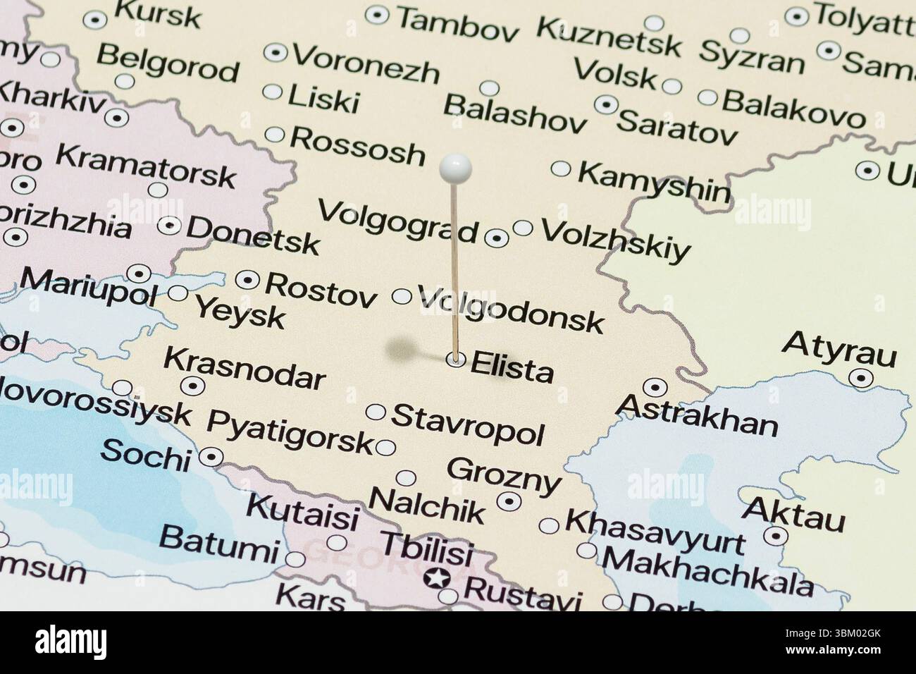 macro photo of a white pin needle into Elista city of Russia political ...