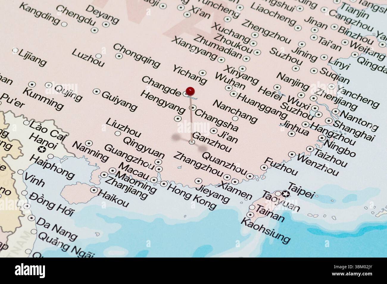 macro photo of a red pin needle into Ganzhou city of China political ...