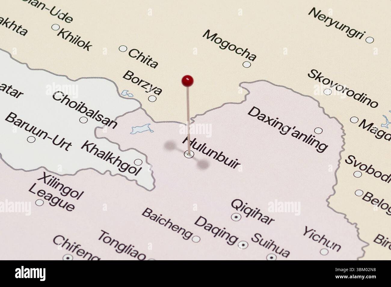 macro photo of a red pin needle into Hulunbuir city of China political ...