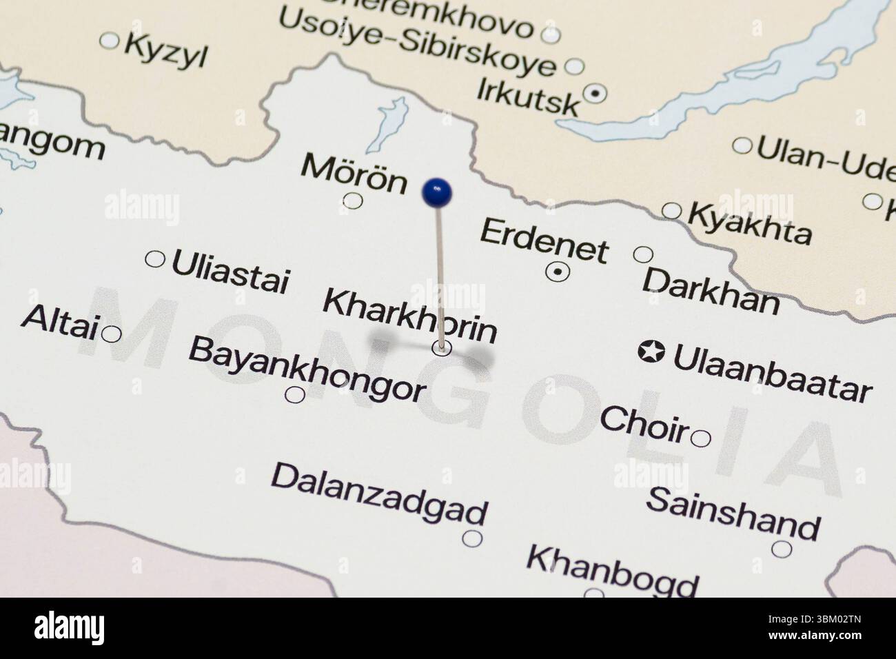 macro photo of a blue pin needle into kharkhorin city of Mongolia ...