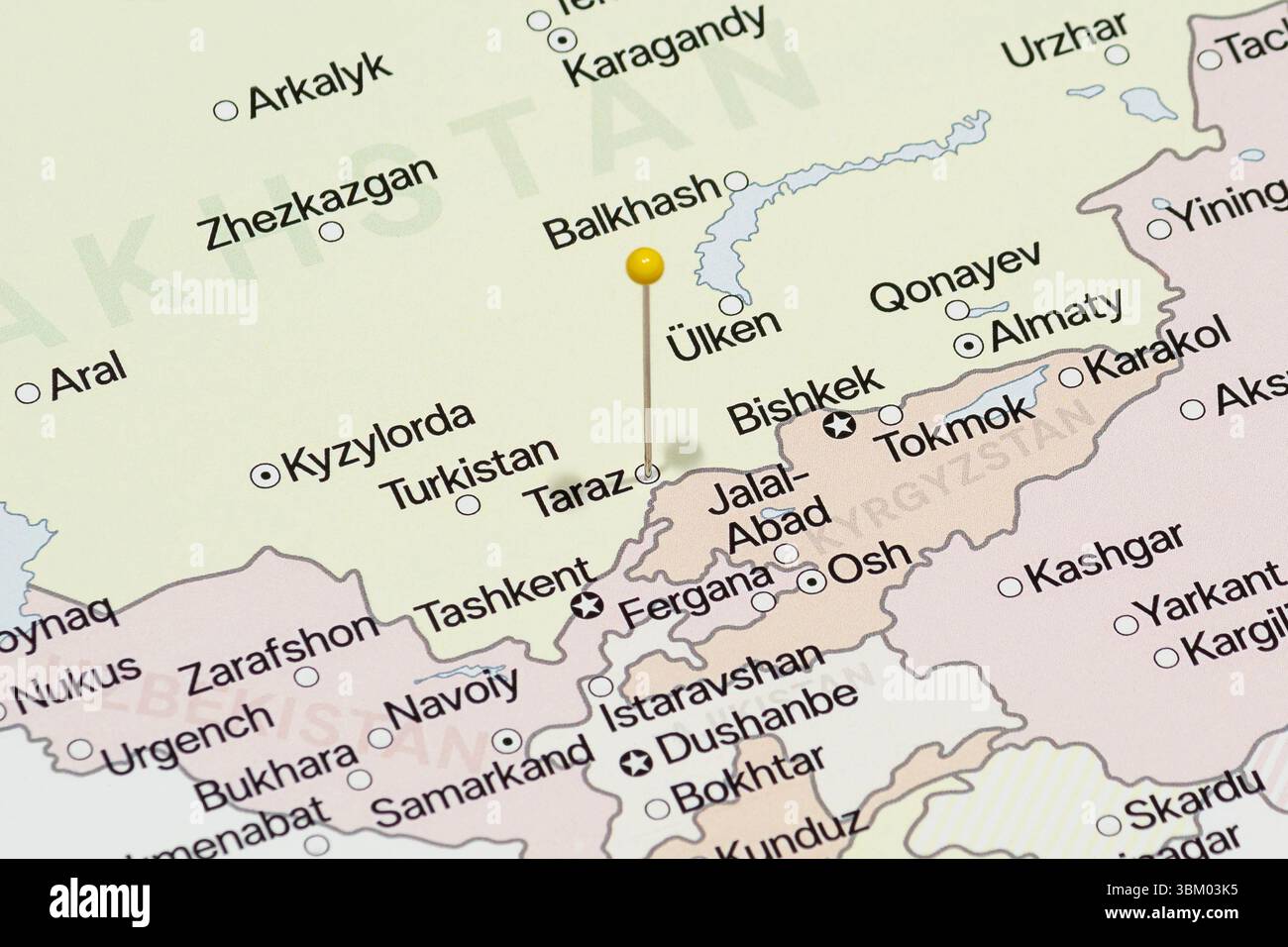 macro photo of a yellow pin needle into Taraz city of Kazakhstan ...