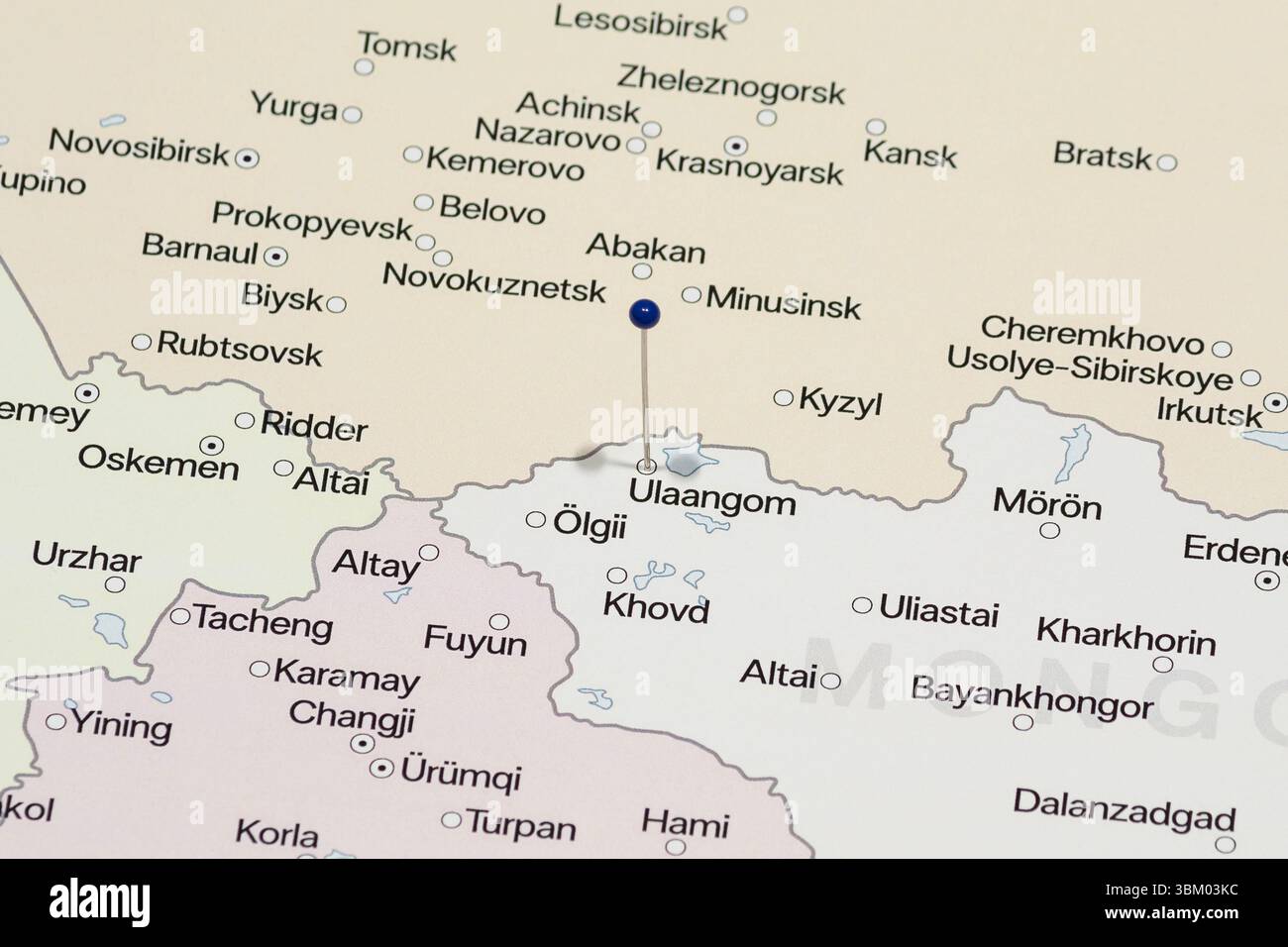 macro photo of a blue pin needle into Ulaangom city of Mongolia ...