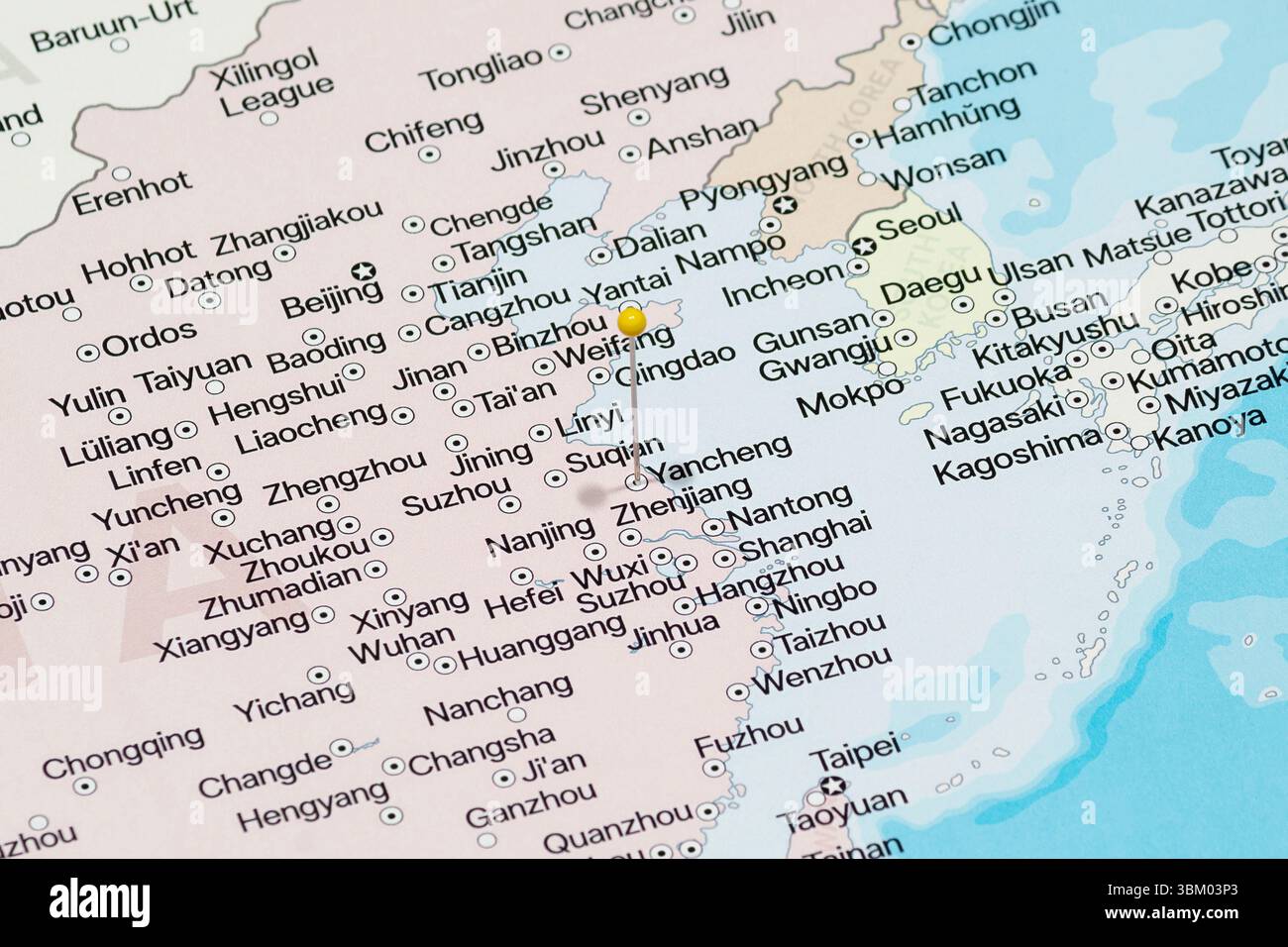 macro photo of a yellow pin needle into Yancheng city of China ...