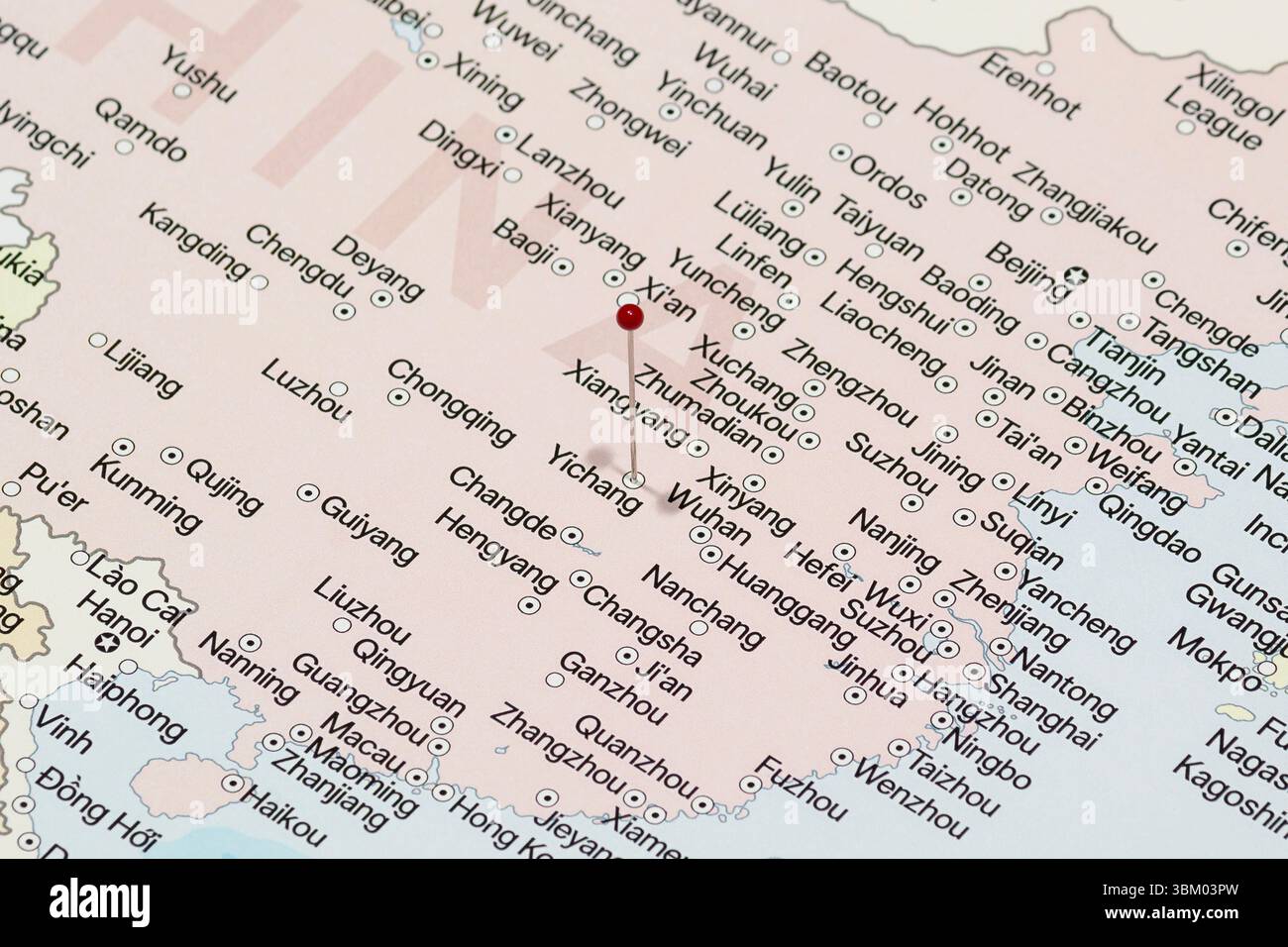 macro photo of a red pin needle into Yichang city of China political ...