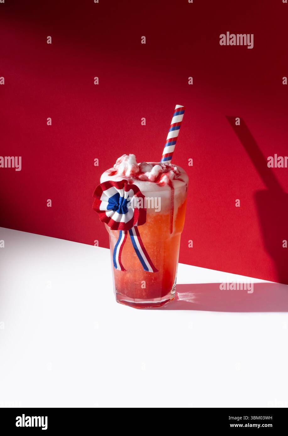 Close up of typical chilean cocktail "terremoto" on a red background ...