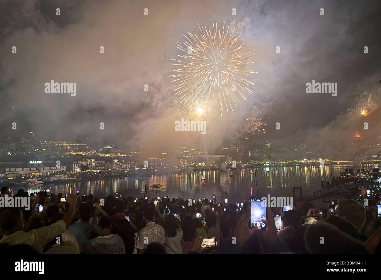 People watch fireworks explode above the Douro river celebrating the ...