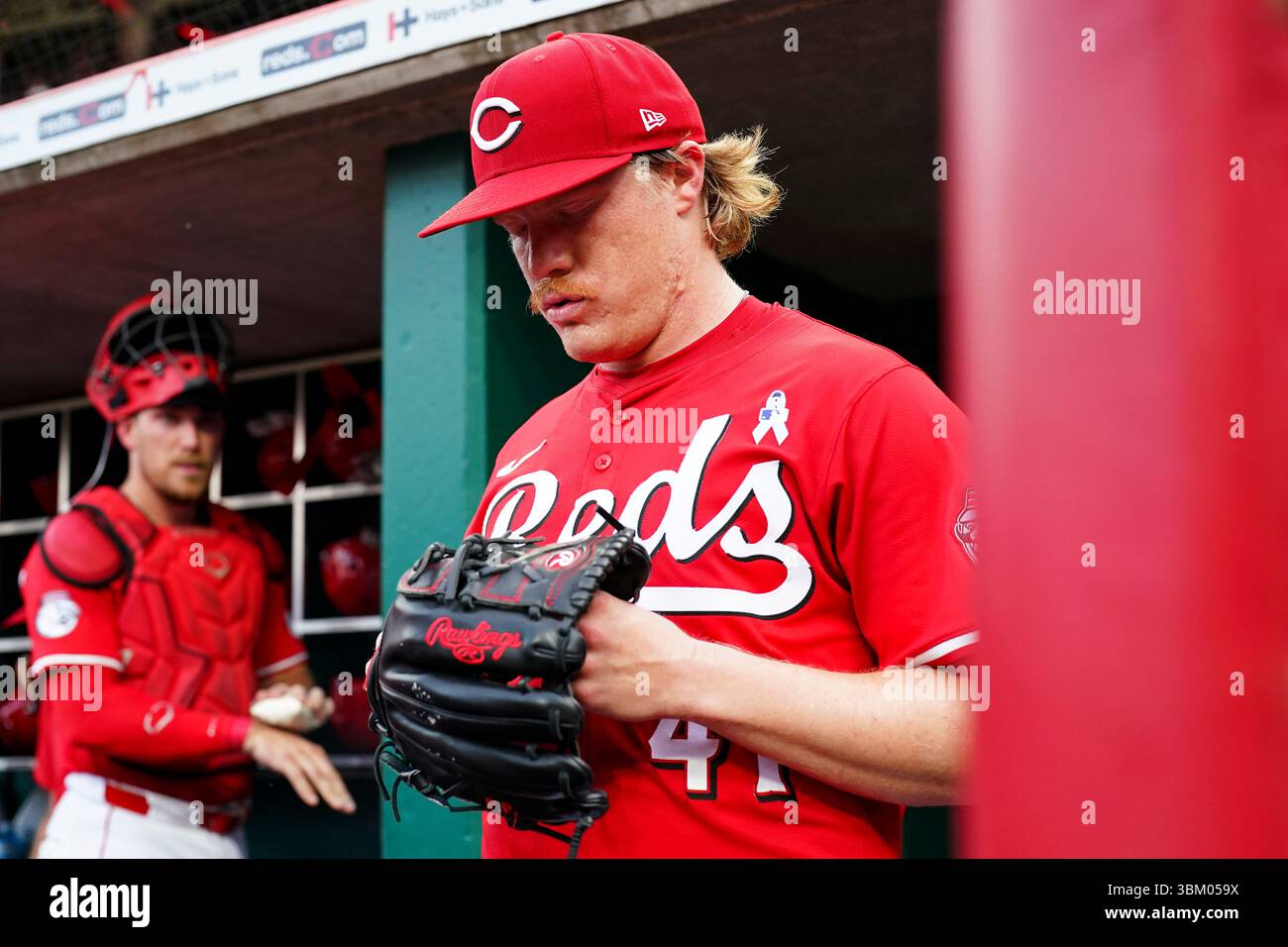 Cincinnati Reds pitcher Andrew Abbott walks out of the dugout during a ...