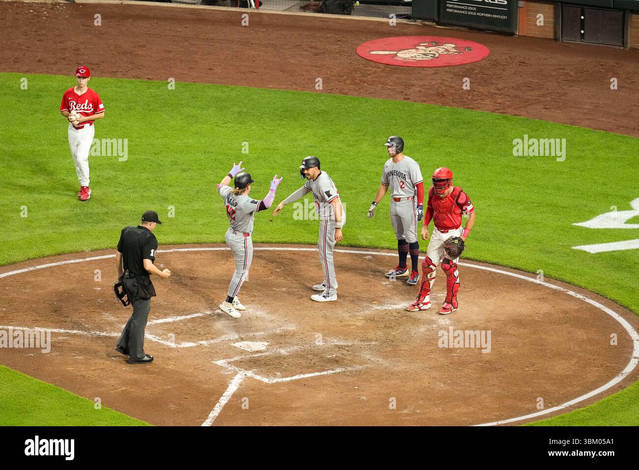 Minnesota Twins' Harrison Bader celebrates with teammates after hitting ...