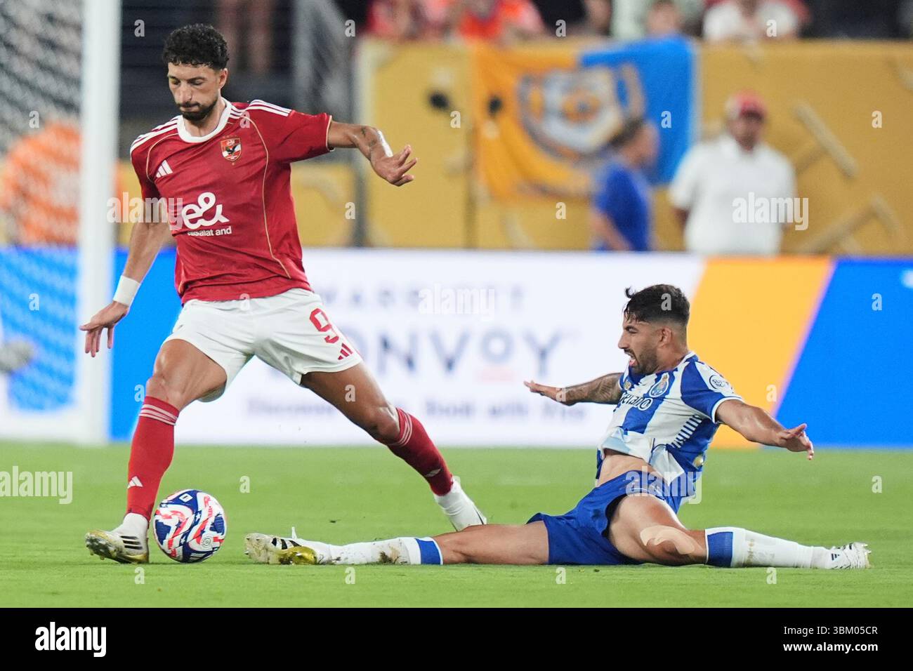 Al Ahly's Wessam Abou Ali, left, and Porto's Alan Varela compete for ...