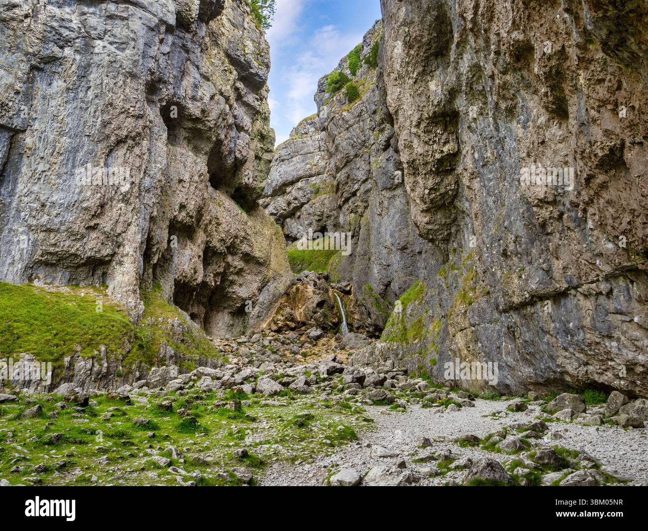 Gordale Scar, a limestone ravine with overhanging limestone cliffs over ...