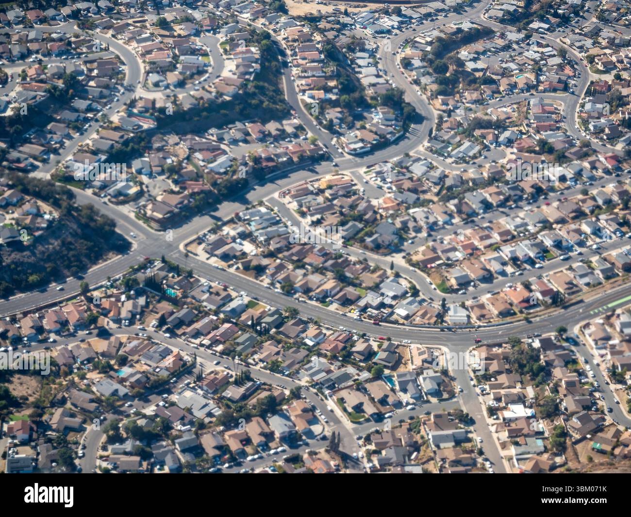 An aerial view shows a densely populated suburban neighborhood with ...