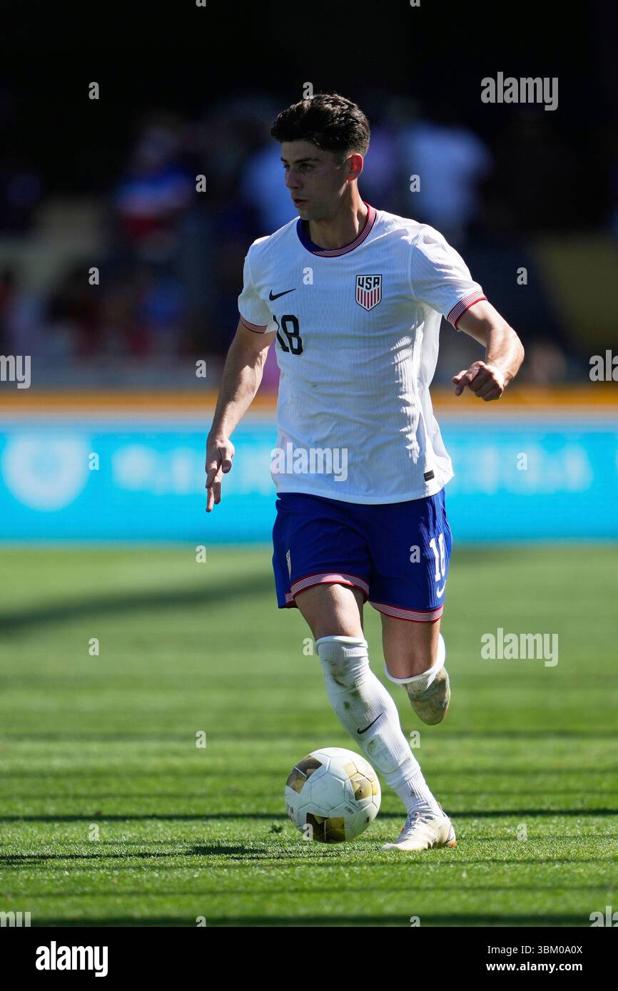 United States midfielder Max Arfsten (18) brings the ball up the field ...