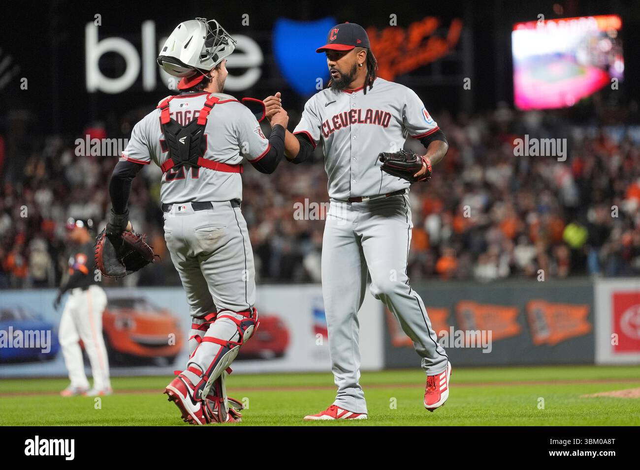 Cleveland Guardians catcher Austin Hedges, left, celebrates with ...