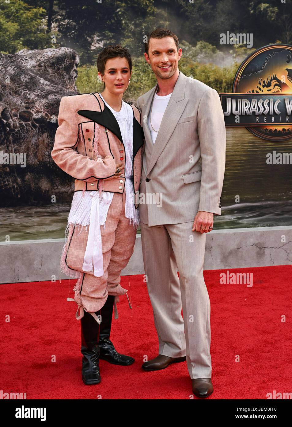Philippine Velge, left, and Ed Skrein attend the "Jurassic World ...