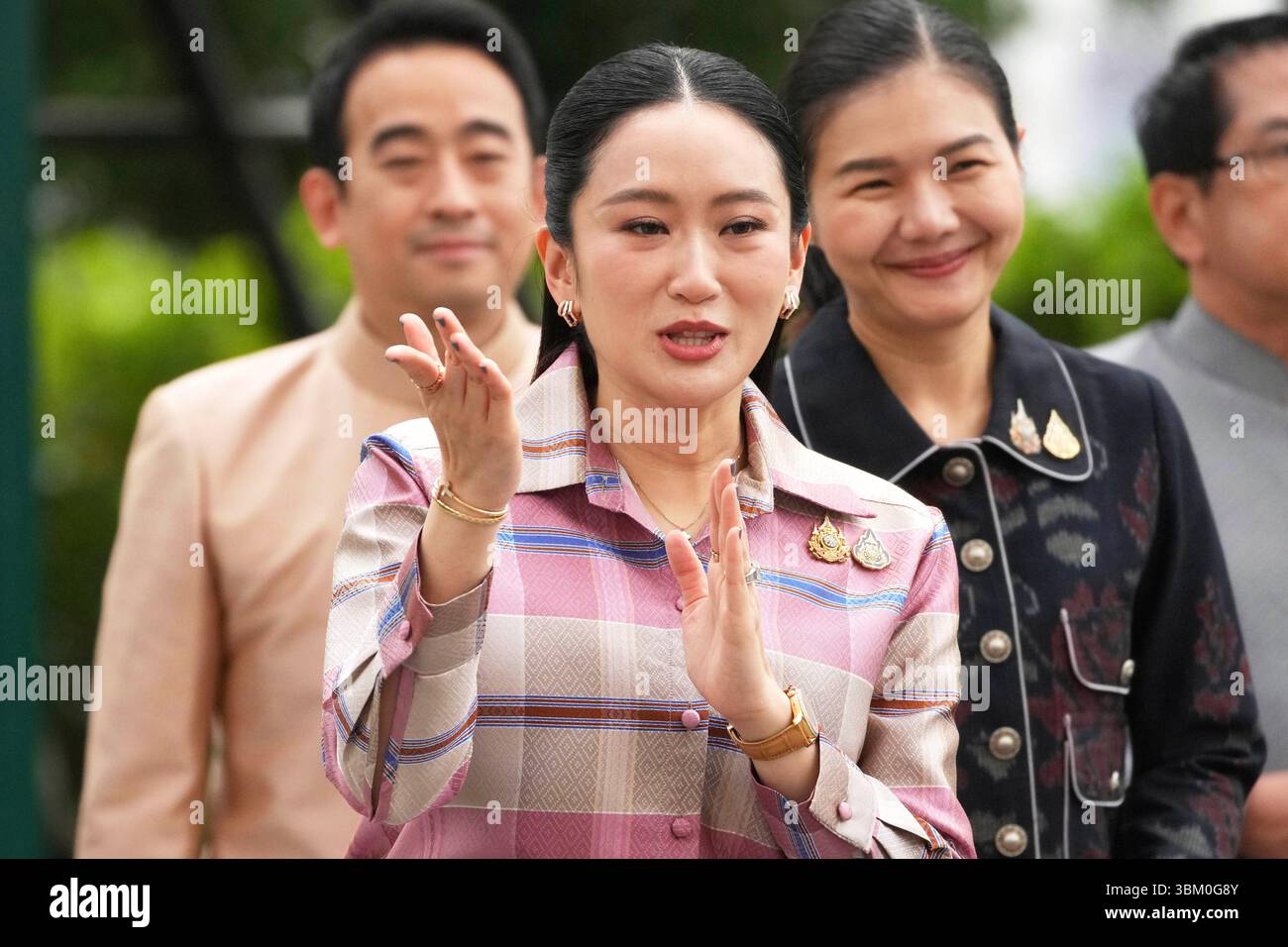 Thailand's Prime Minister Paetongtarn Shinawatra, center, arrives at Government House for a ...