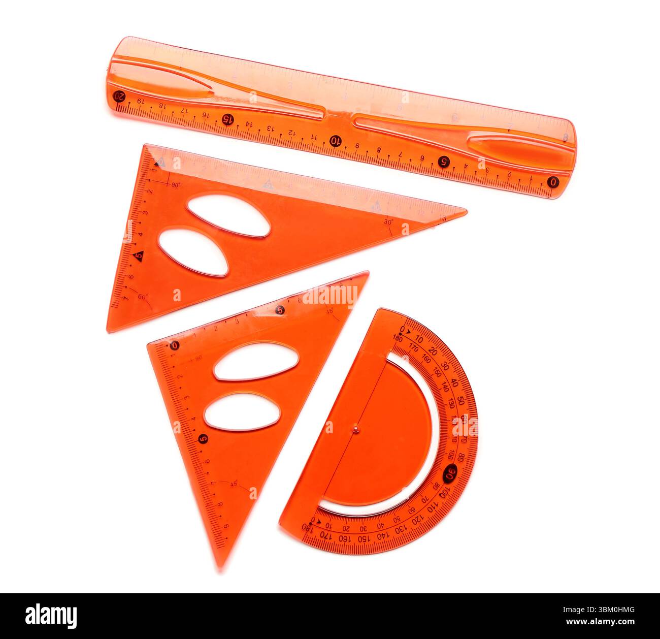 Orange straight and triangle plastic rulers with protractor on white ...