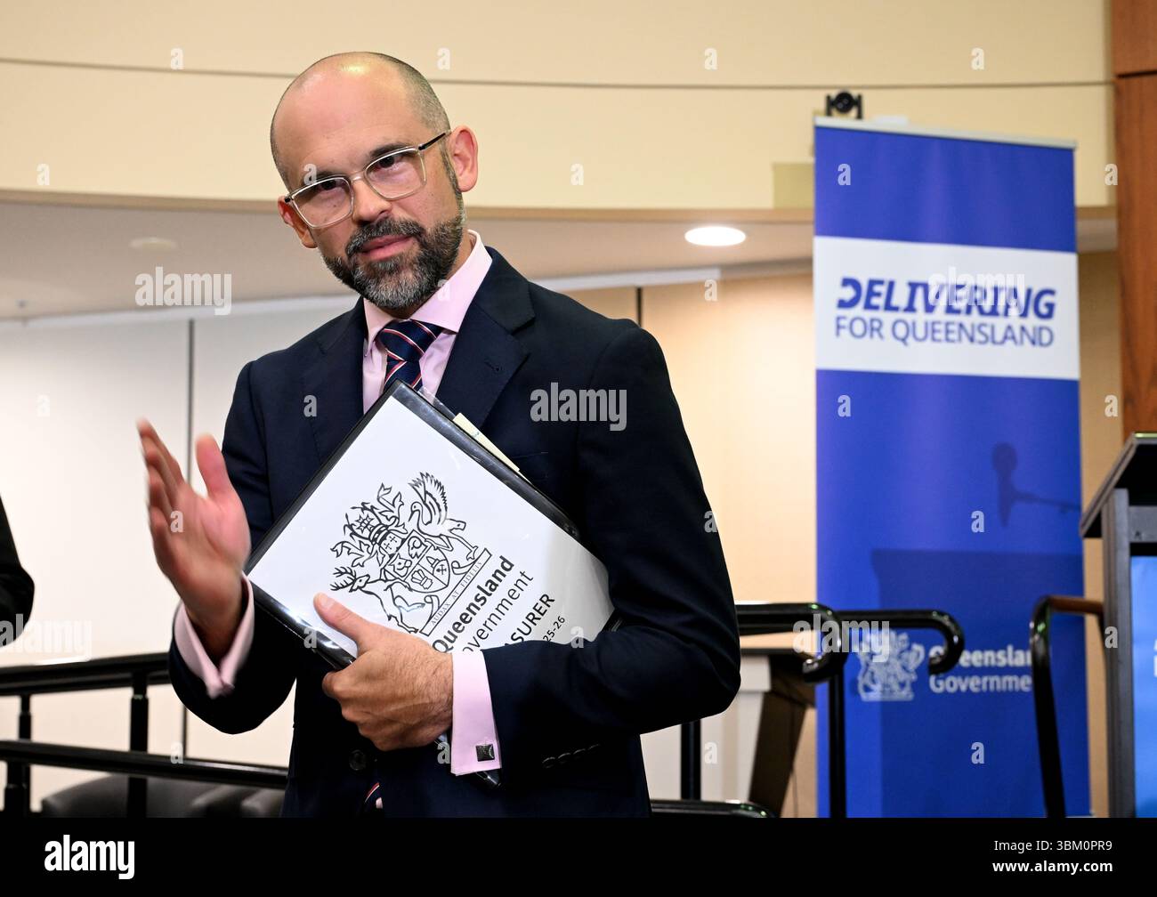 Queensland Treasurer David Janetzki is seen talking to the media before ...