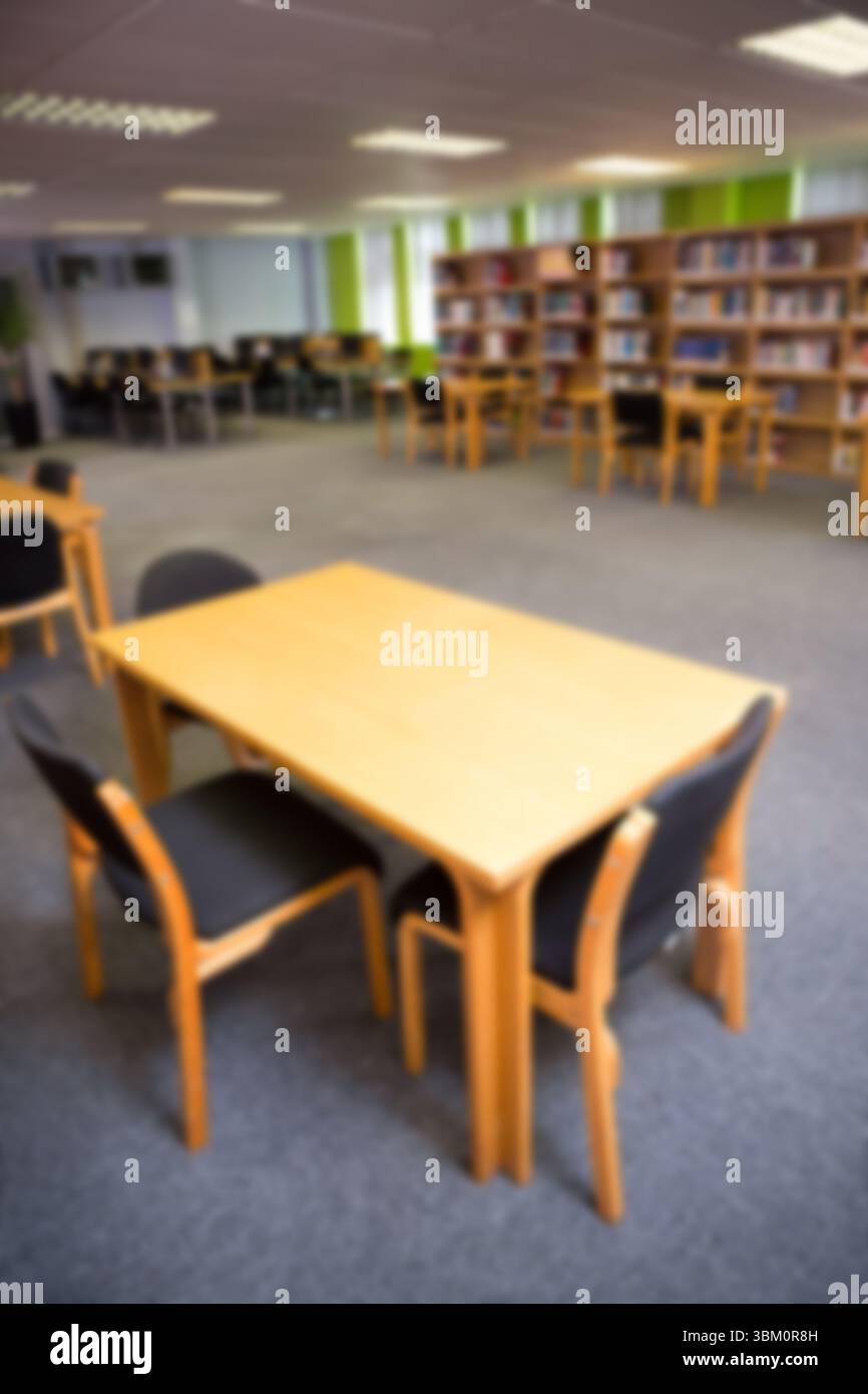 Table and chairs in library Stock Photo - Alamy