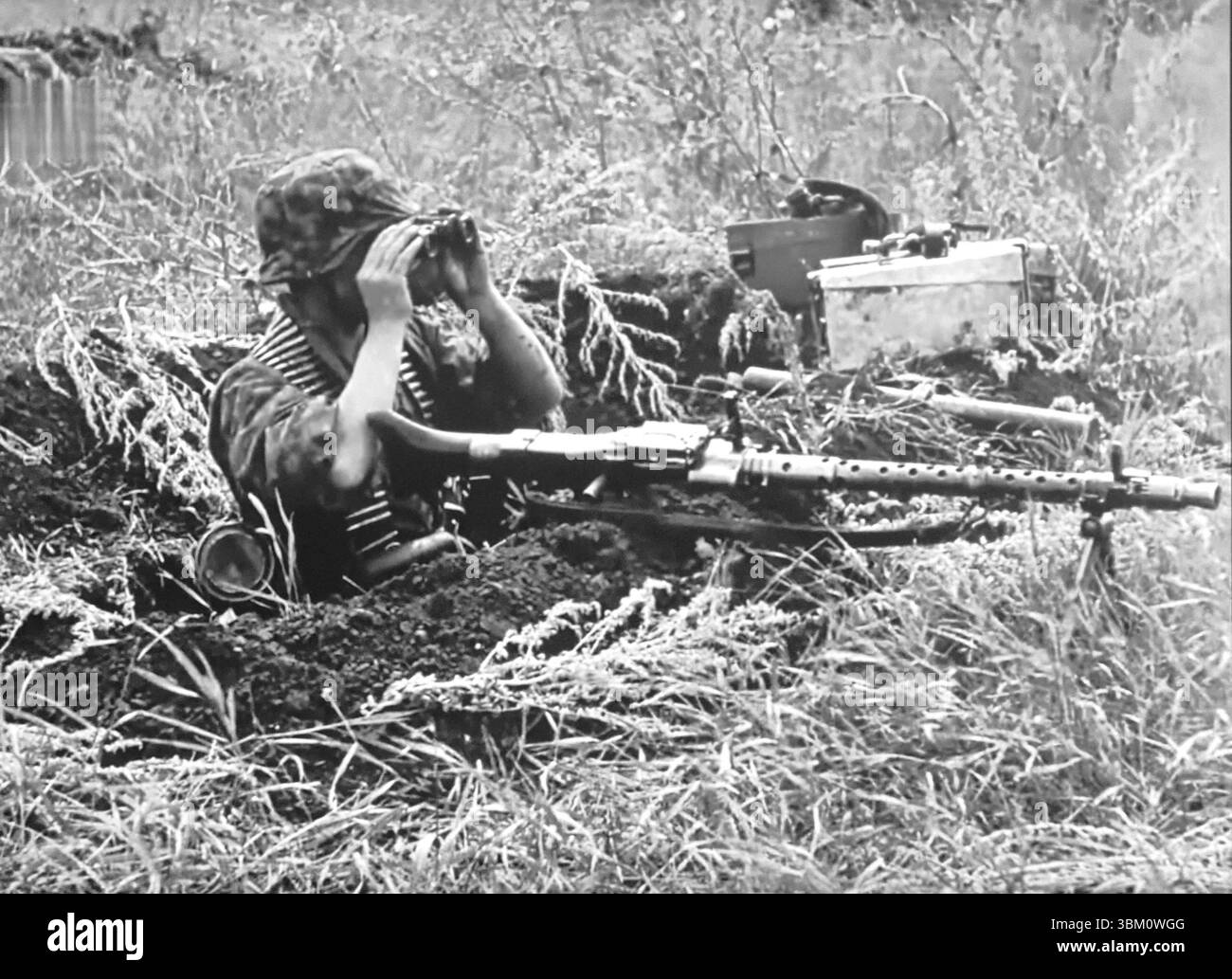 WW2 Screen B&W Still German Soldier in Camo Smock scans for enemy ...