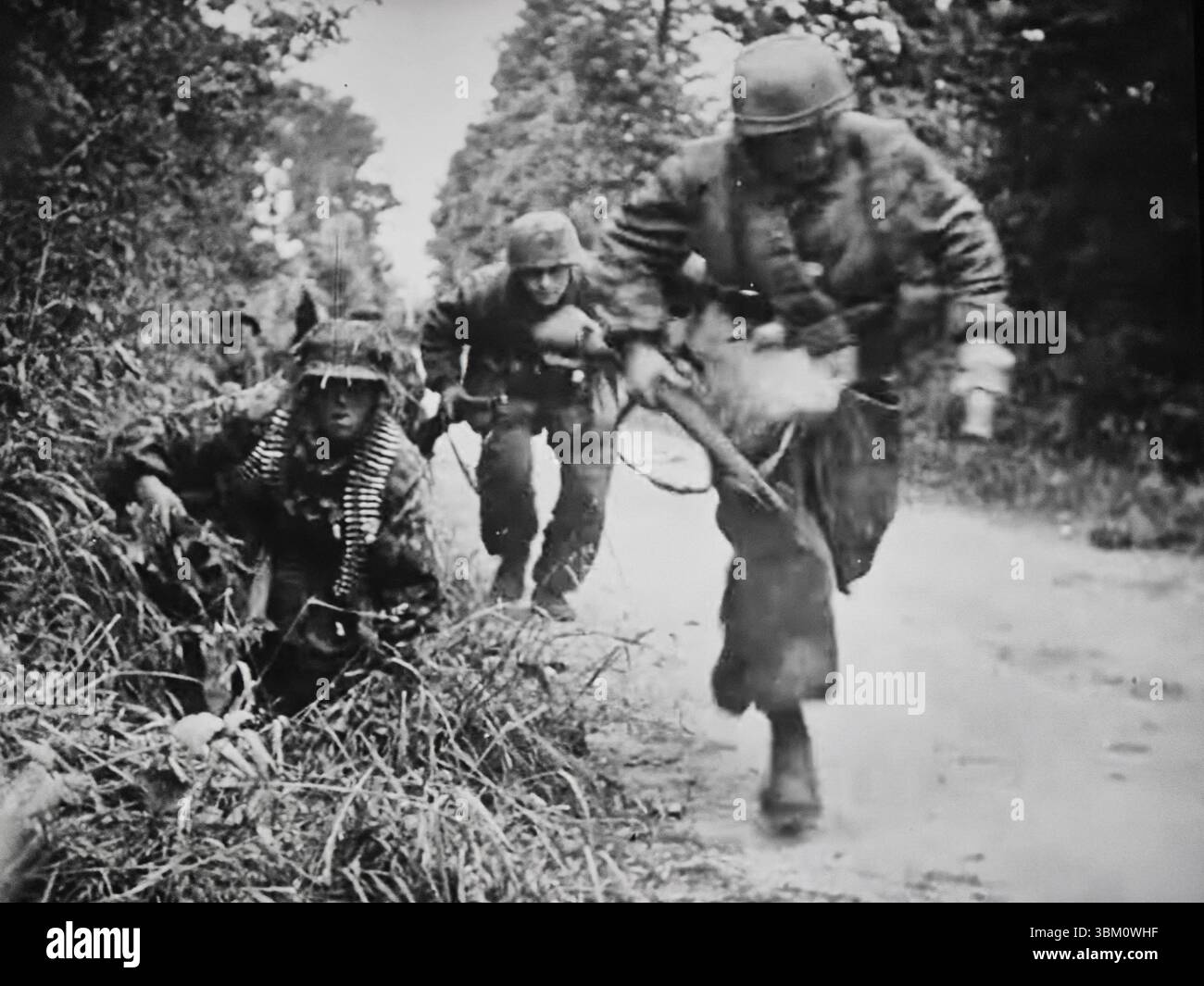WW2 Screen B&W Still German Para Troops rush forward in the Hedgerows ...
