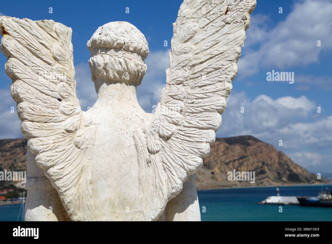 Close-up of the angel statue in Agia Galini, Crete, showing its broken ...