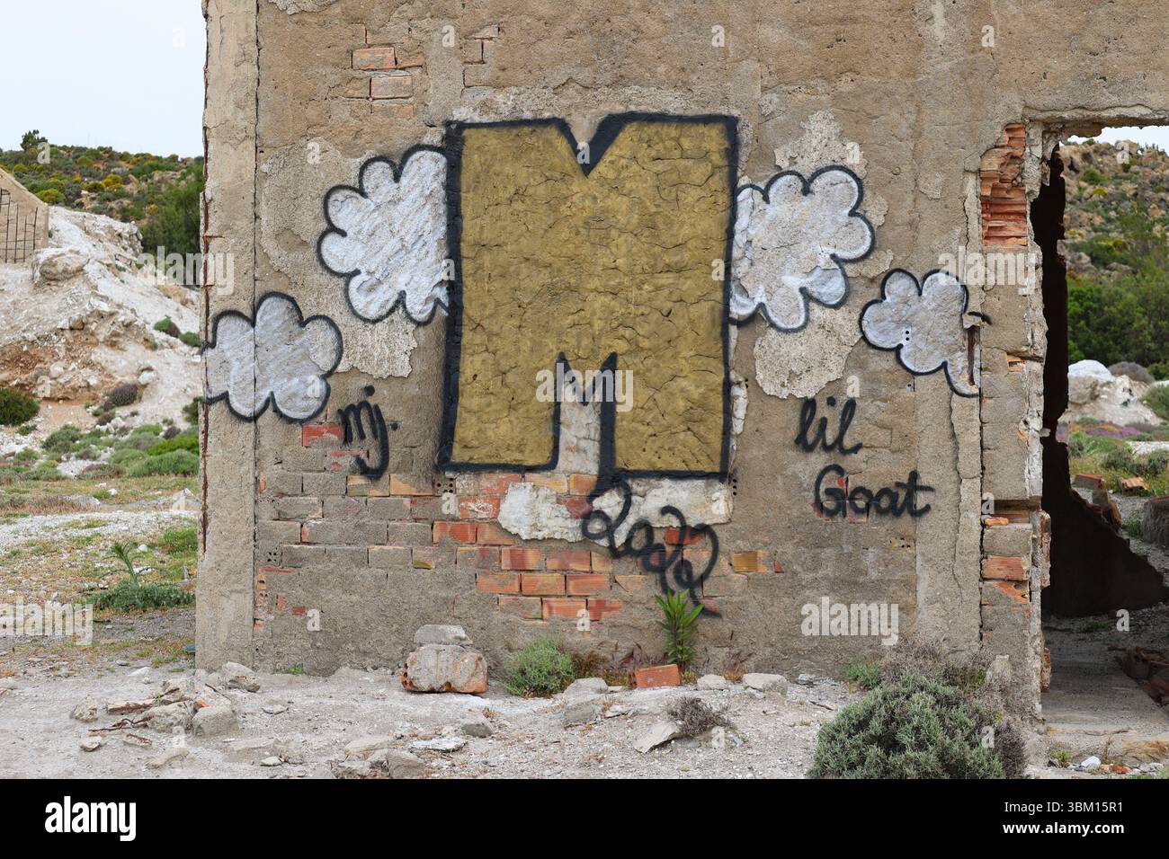 Modern graffiti contrasts with crumbling walls in a forgotten rural ...