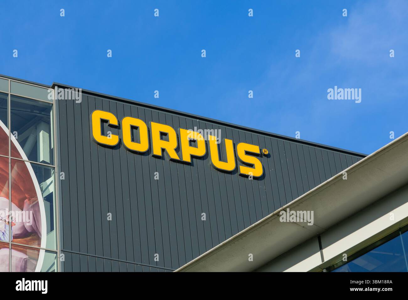 The striking "CORPUS" sign, in bold yellow against a dark modern ...
