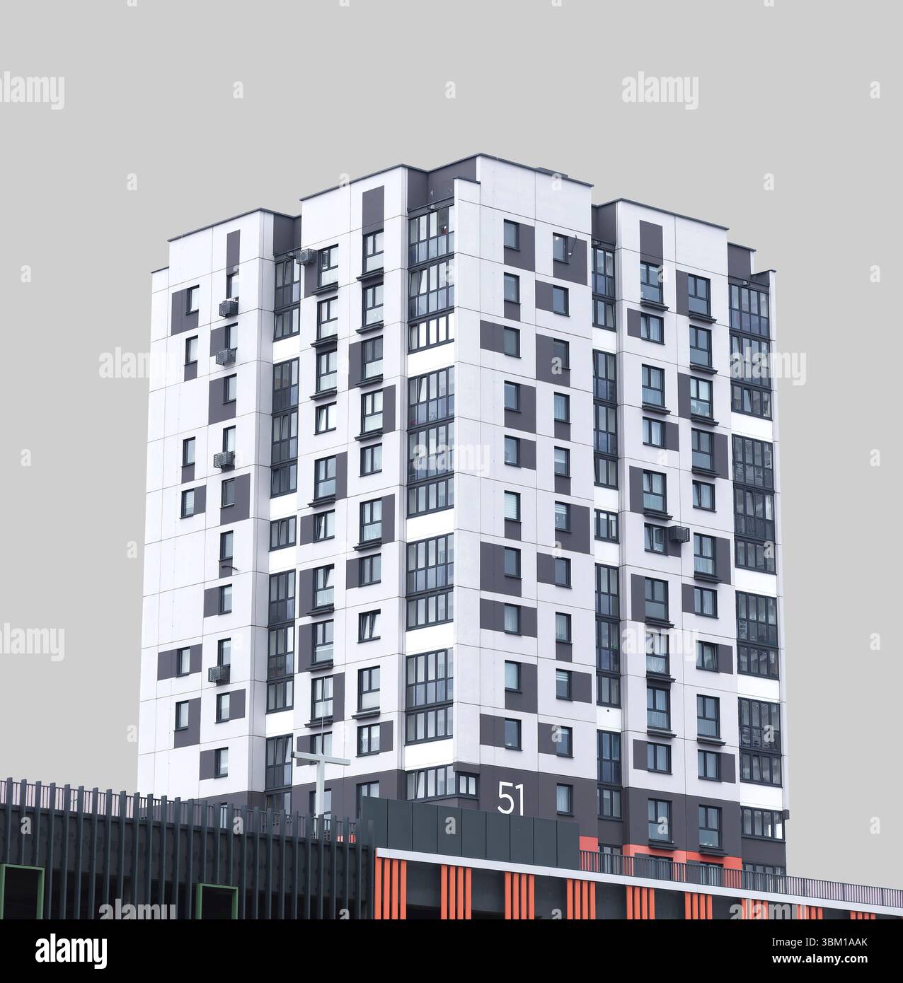 Highrise apartment building with geometric facade and tall elevation ...