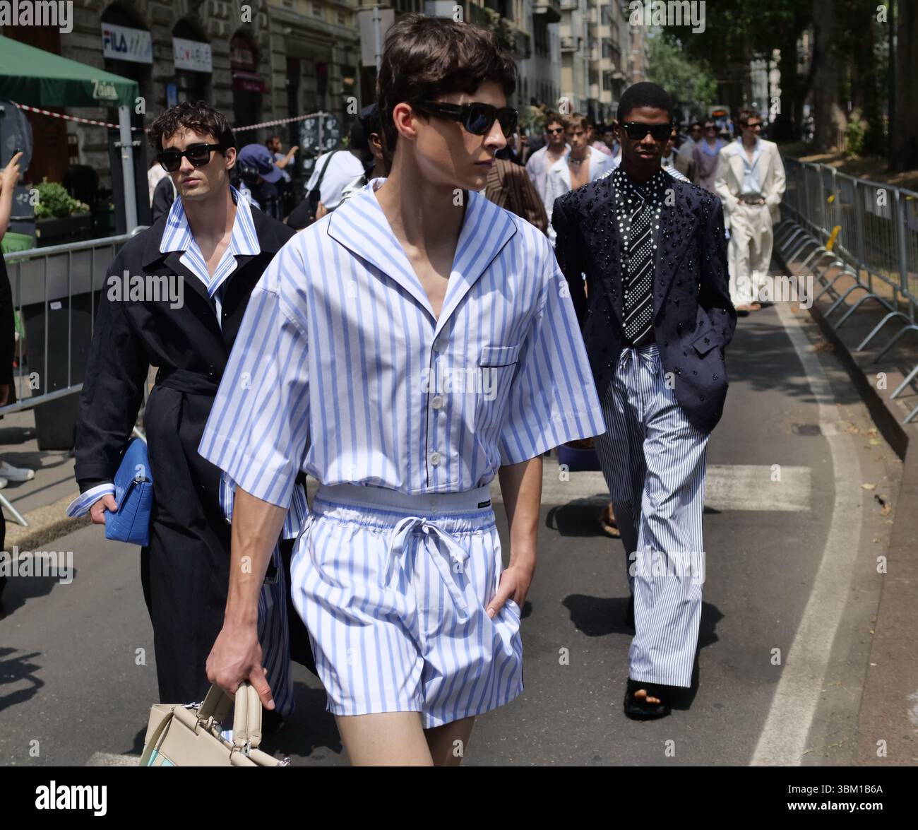 Men models walking in the street during Dolce & Gabbana fashion show ...