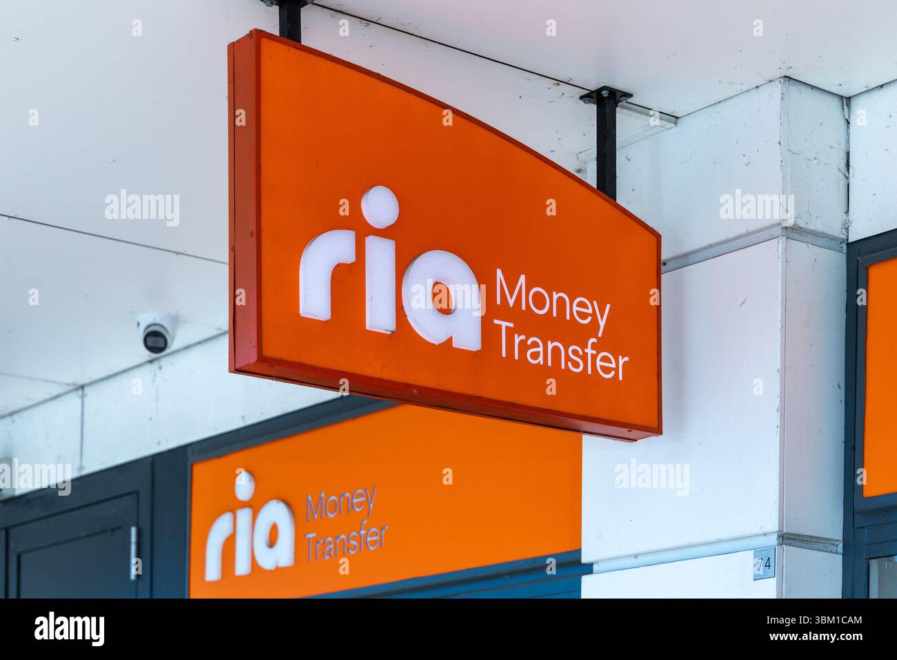 Ria Money Transfer sign on the exterior of a financial service store ...