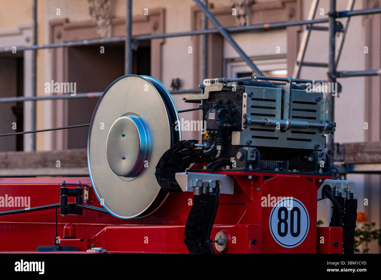 A construction rig is set up at a building site, featuring a large ...