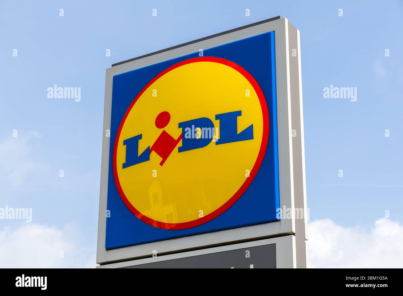 Lidl supermarket logo sign against a blue sky, featuring the iconic ...