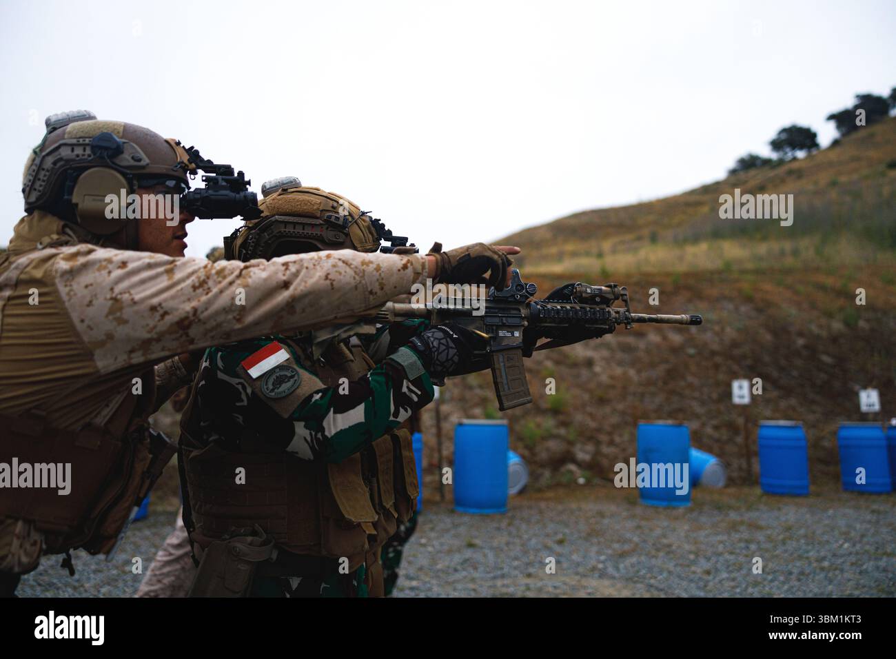 U.S. Marine Corps Sgt. Sergio Romero, left, a radio telephone operator ...