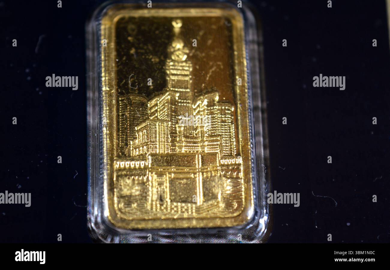 The clock towers of Makkah and the holy Kaaba on 24K karat pure yellow ...
