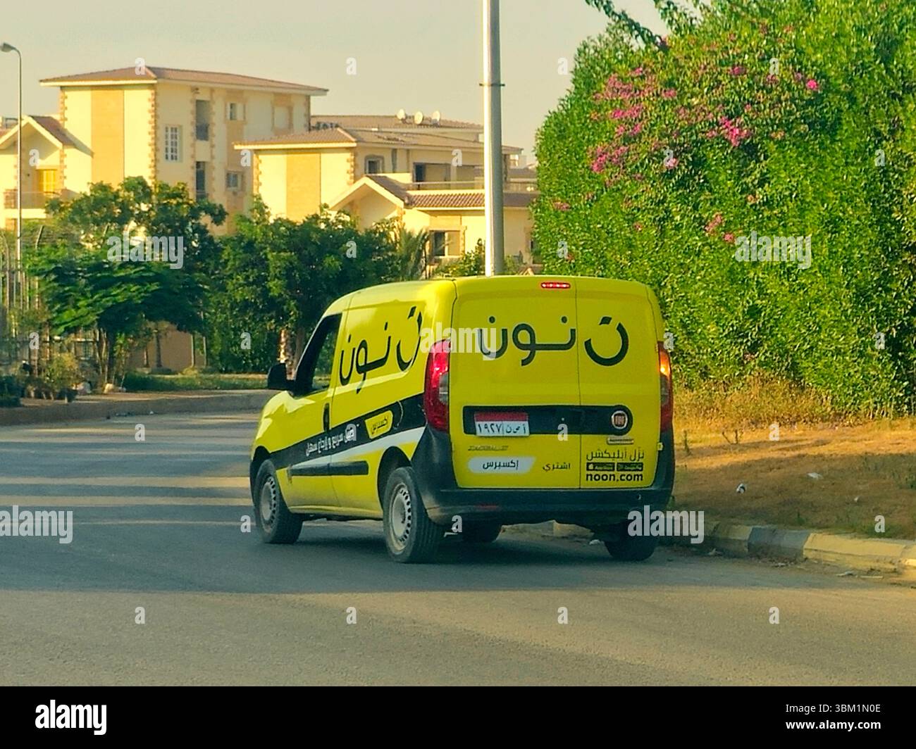 Cairo, Egypt, June 14 2025: Noon online shopping delivery yellow van to ...