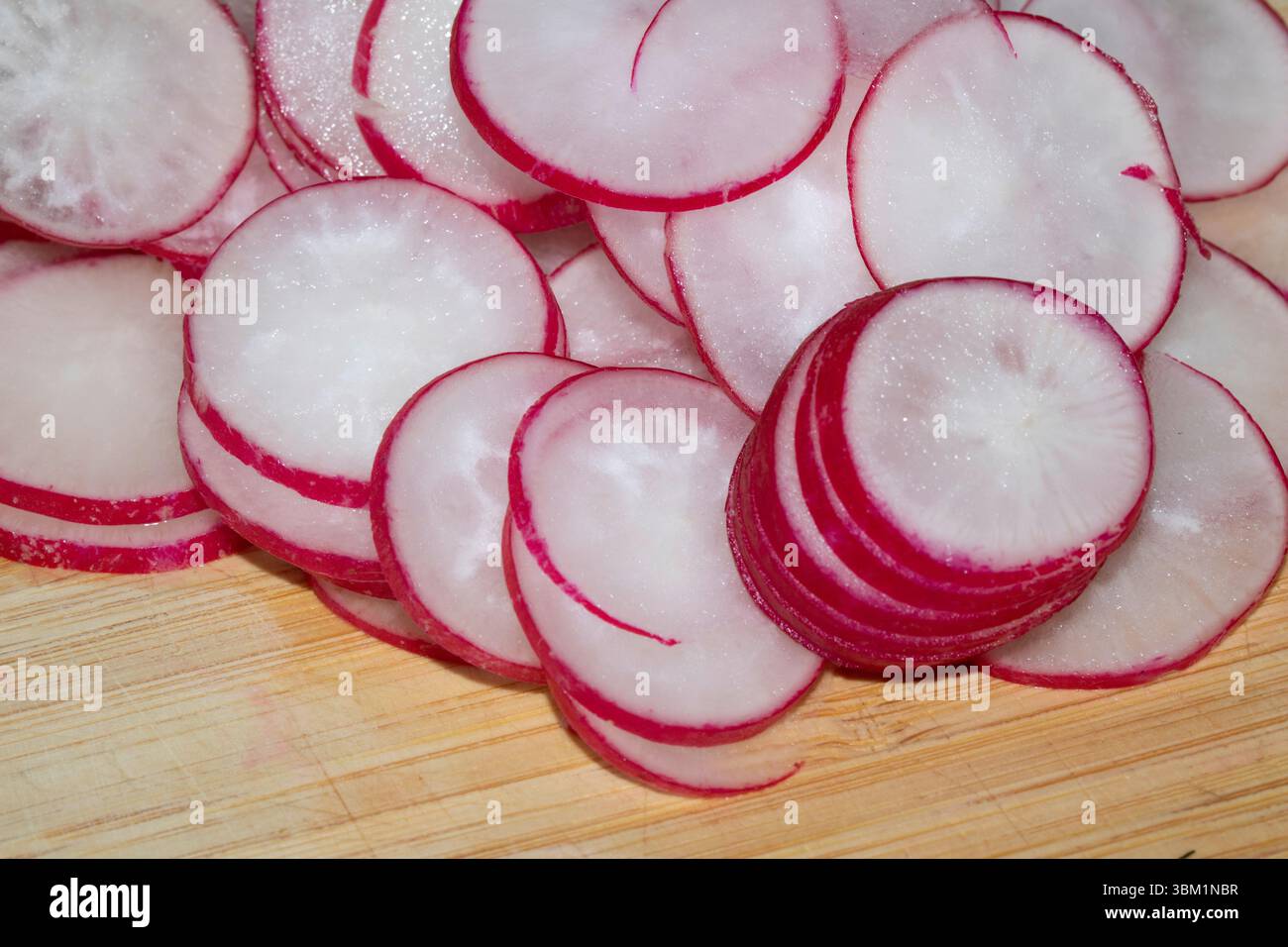 Chopped Up Sliced Radish on a Chopping Board in a Kitchen Stock Photo ...