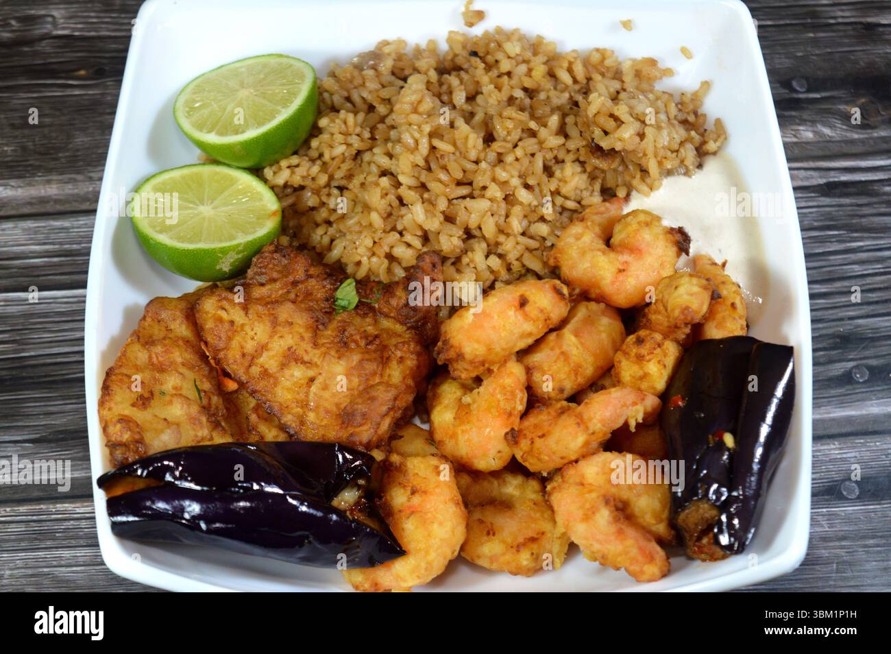 A plate of seafood of Fried Epinephelus fish fillet, Egyptian fish rice ...