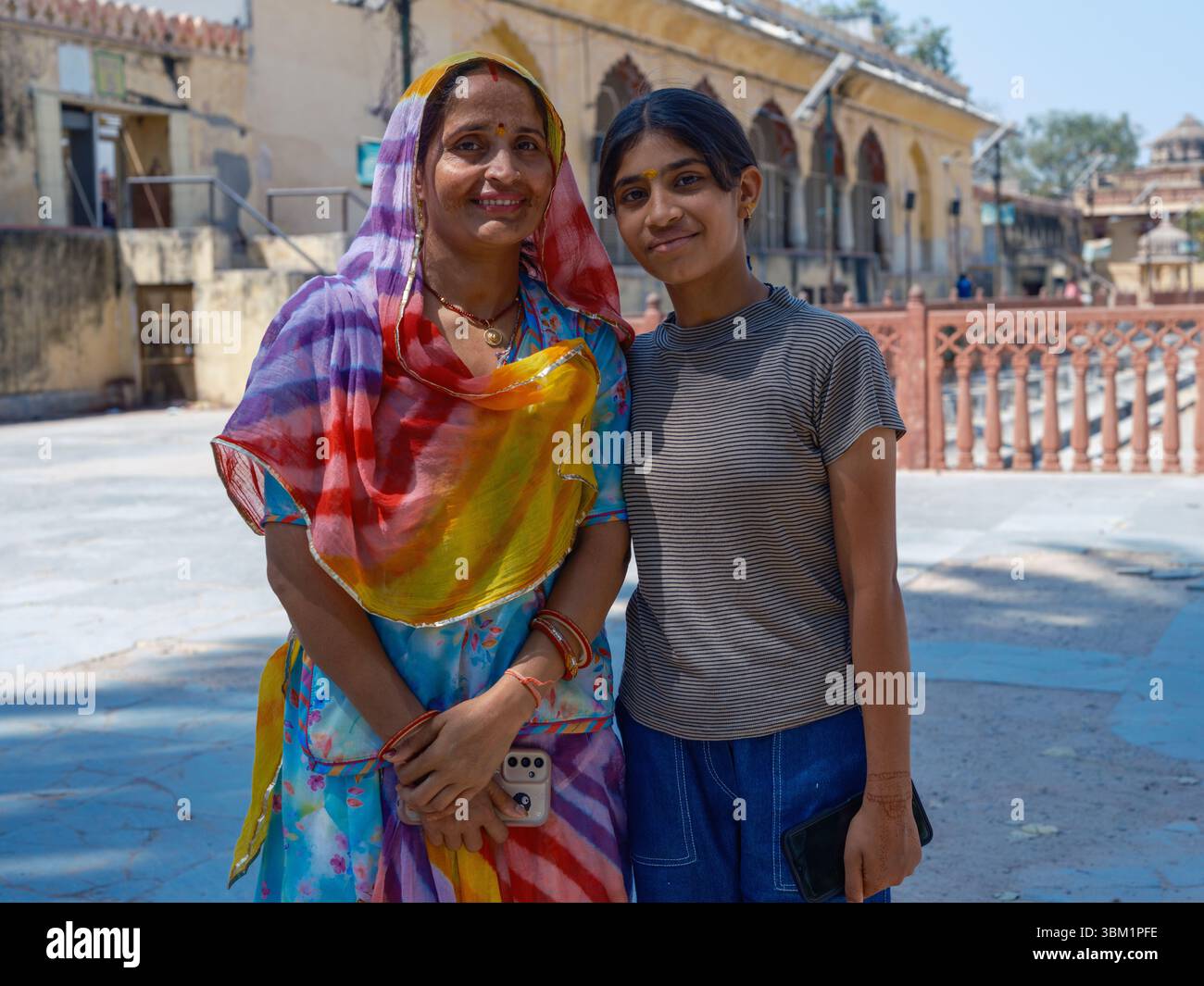 India, Jaipur, 16 Mar 2025. Mother and daughter in colorful attire ...