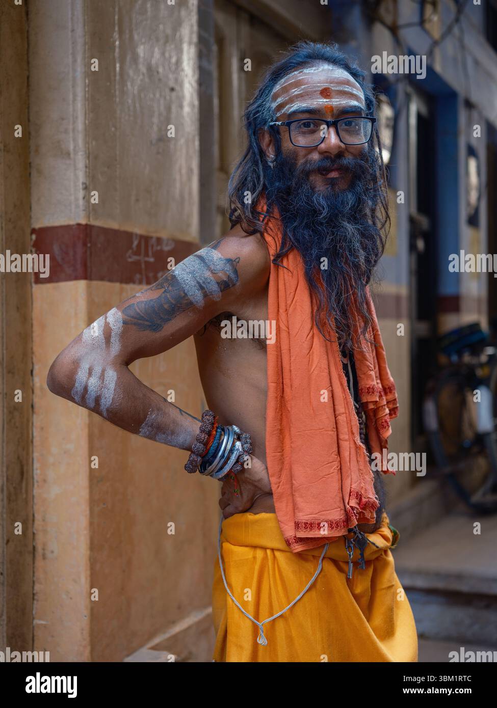 India, Varanasi, 16 Mar 2025. Hindu sadhu with painted forehead and ...