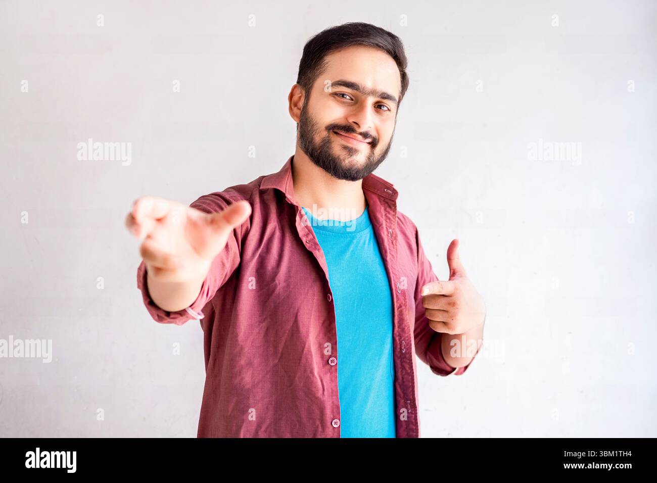Young people wearing maroon hi-res stock photography and images - Alamy
