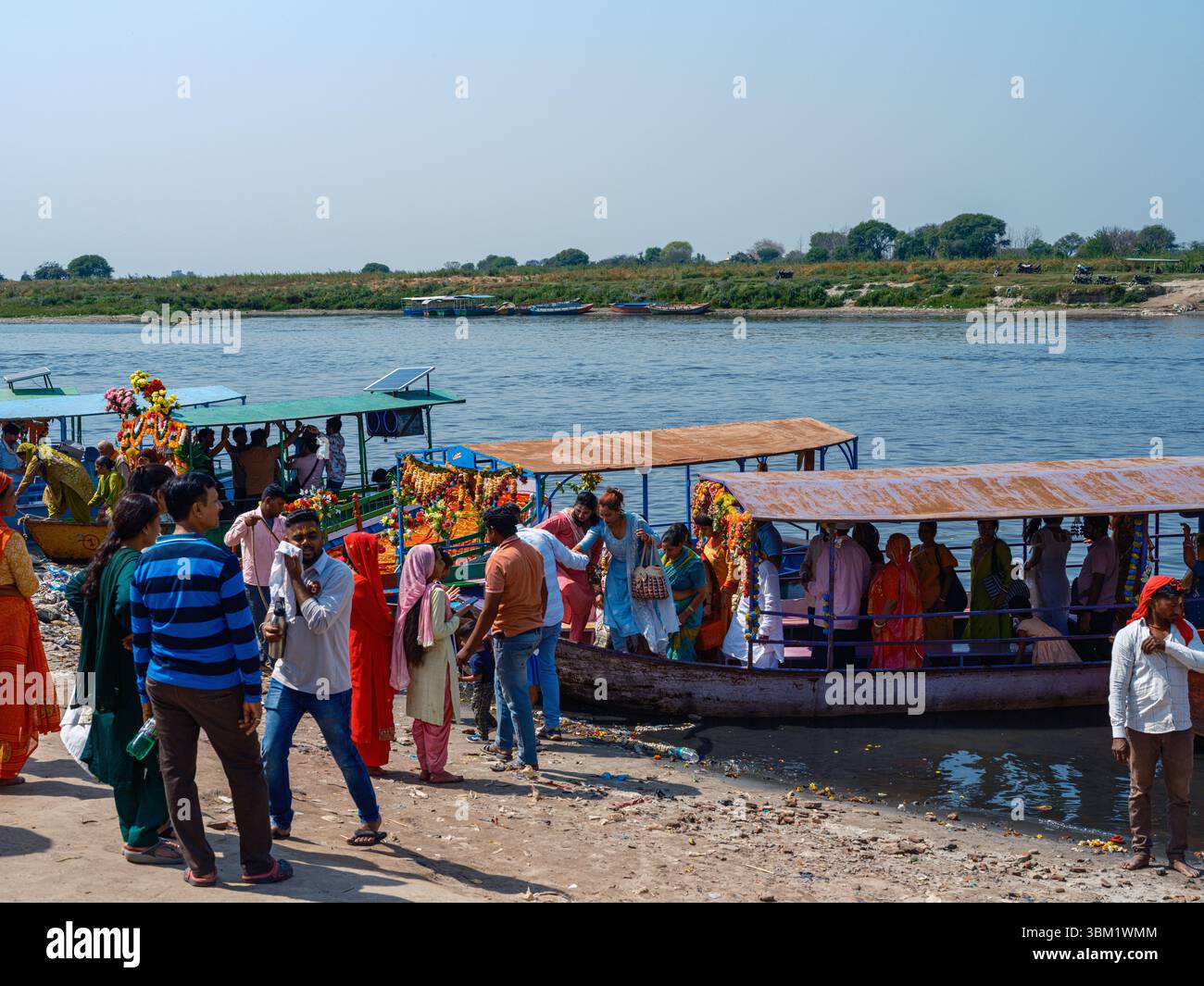 India, Vrindavan, 14 Mar 2025. Colourful boats and pilgrims along the ...