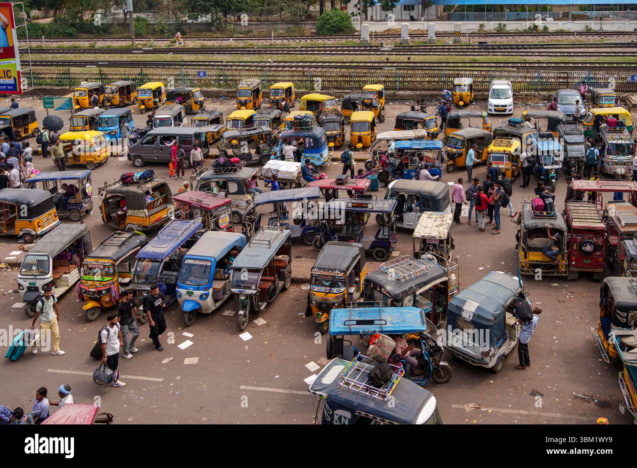 India, Jaipur, 14 Mar 2025. Busy rickshaw and auto rickshaw stand near ...