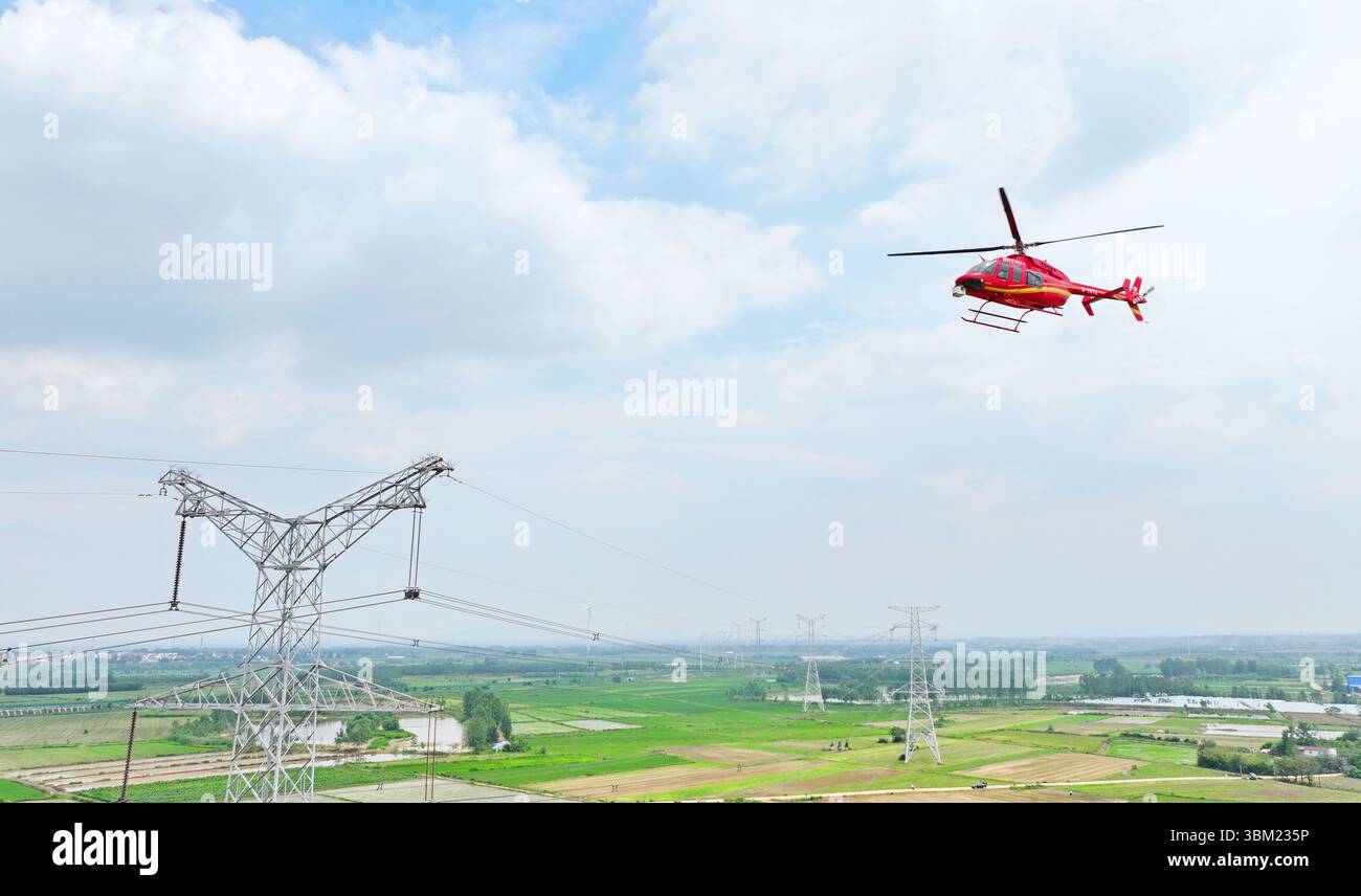 A helicopter is conducting aerial patrol and defect elimination ...