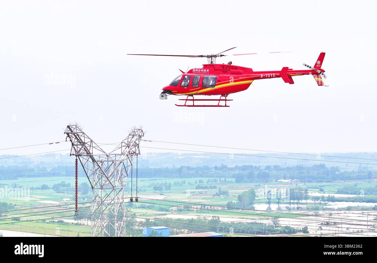 A helicopter is conducting aerial patrol and defect elimination ...