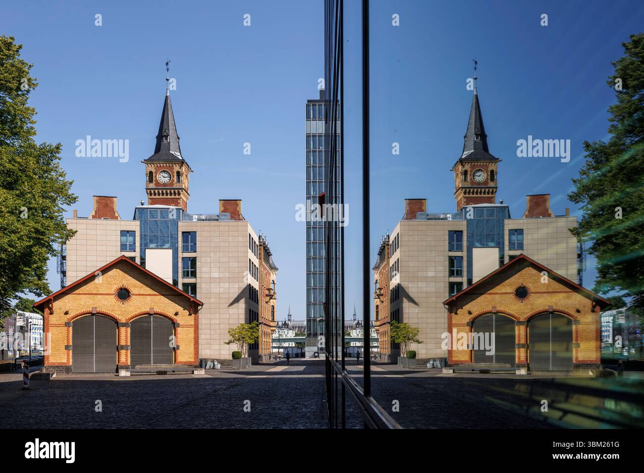 tower of the old harbor masters office with the modern outbuilding at the Rheinau harbour ...
