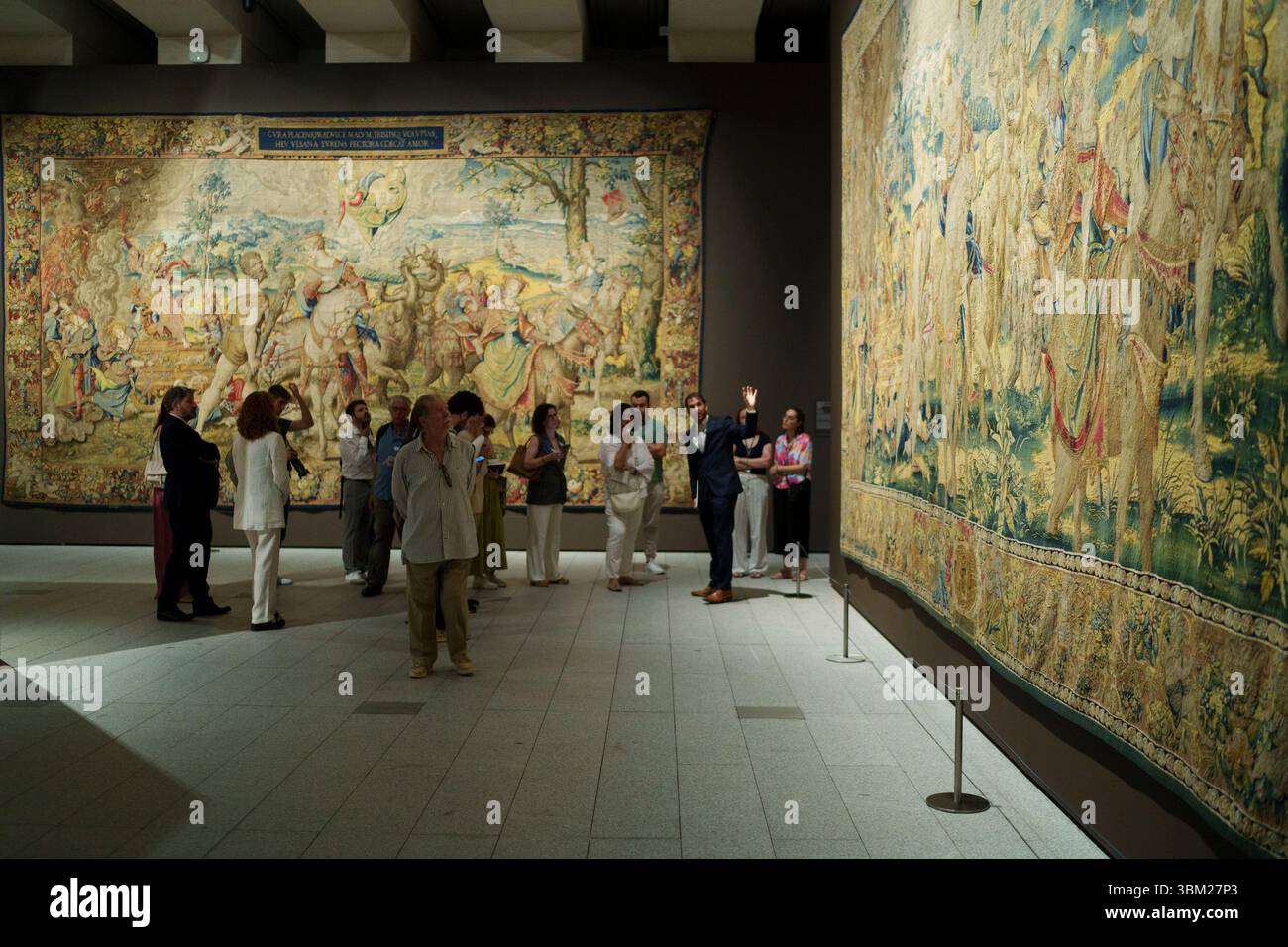 The curator of the exhibition, Roberto Muñoz, offers a guided tour ...