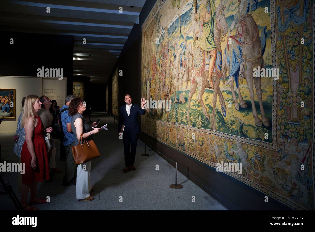 Exhibition curator Roberto Muñoz (r), gives a guided tour during the ...