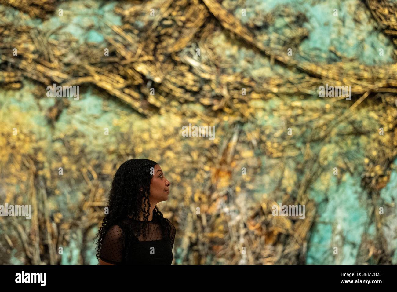 London, UK. 24 June 2025. A staff member with ‘The Starry Night’, 2019 ...